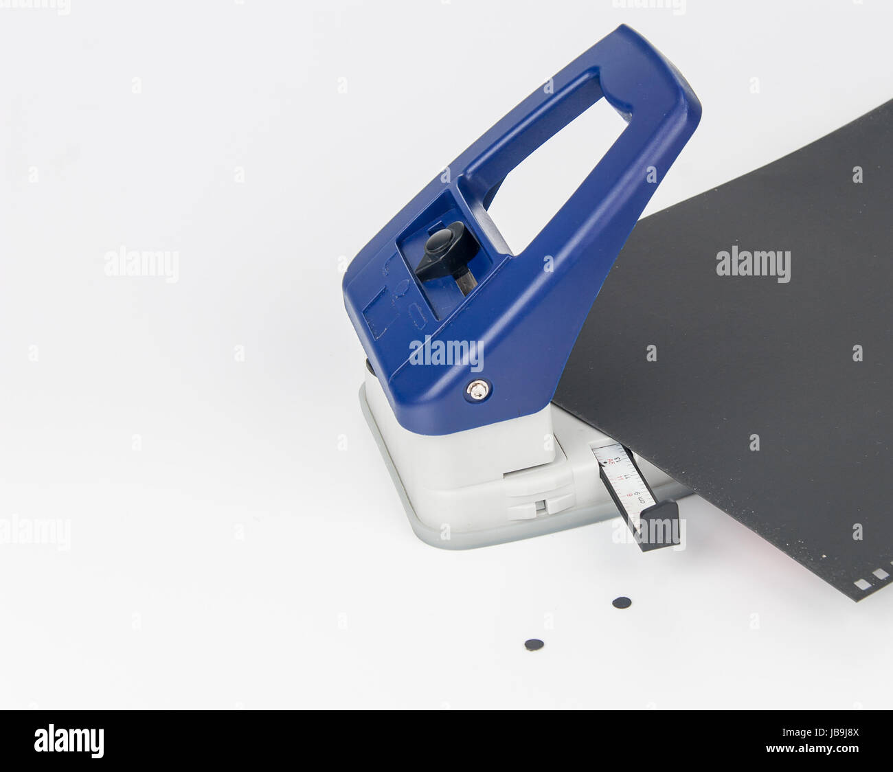 Office Puncher Unit isolated on white background Stock Photo - Alamy