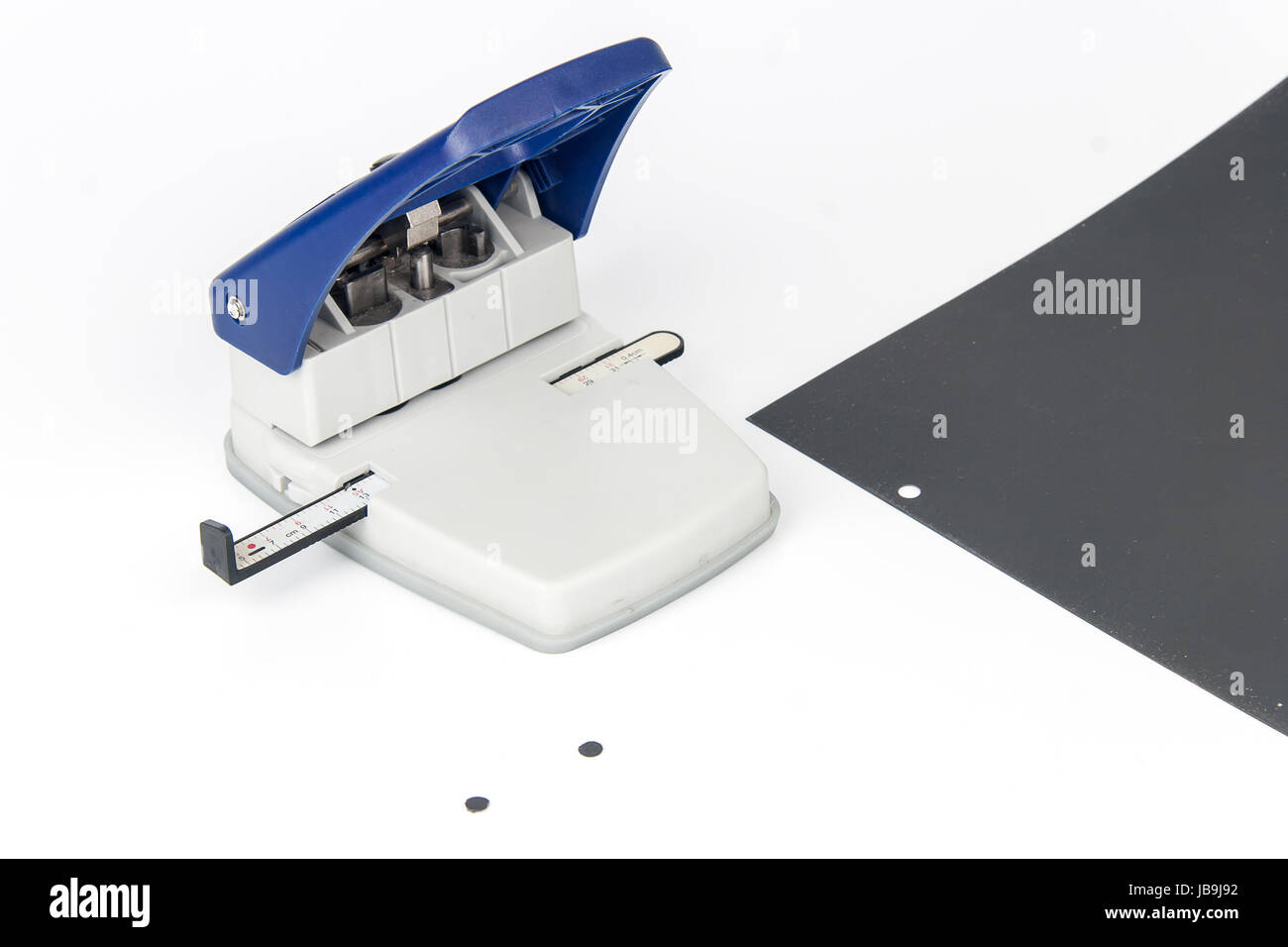 Office Puncher Unit isolated on white background Stock Photo - Alamy