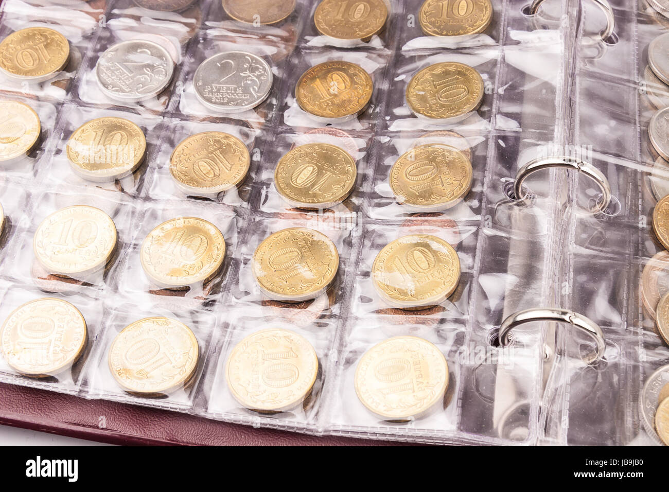 Coin album with world coins Stock Photo - Alamy