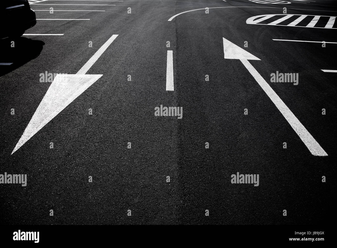Arrow sign as road markings on a street Stock Photo - Alamy