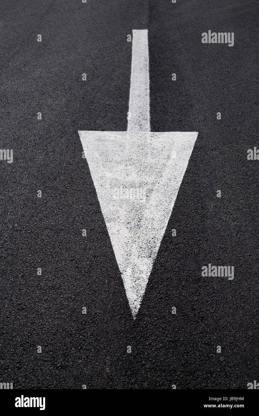 Arrow sign as road markings on a street Stock Photo - Alamy