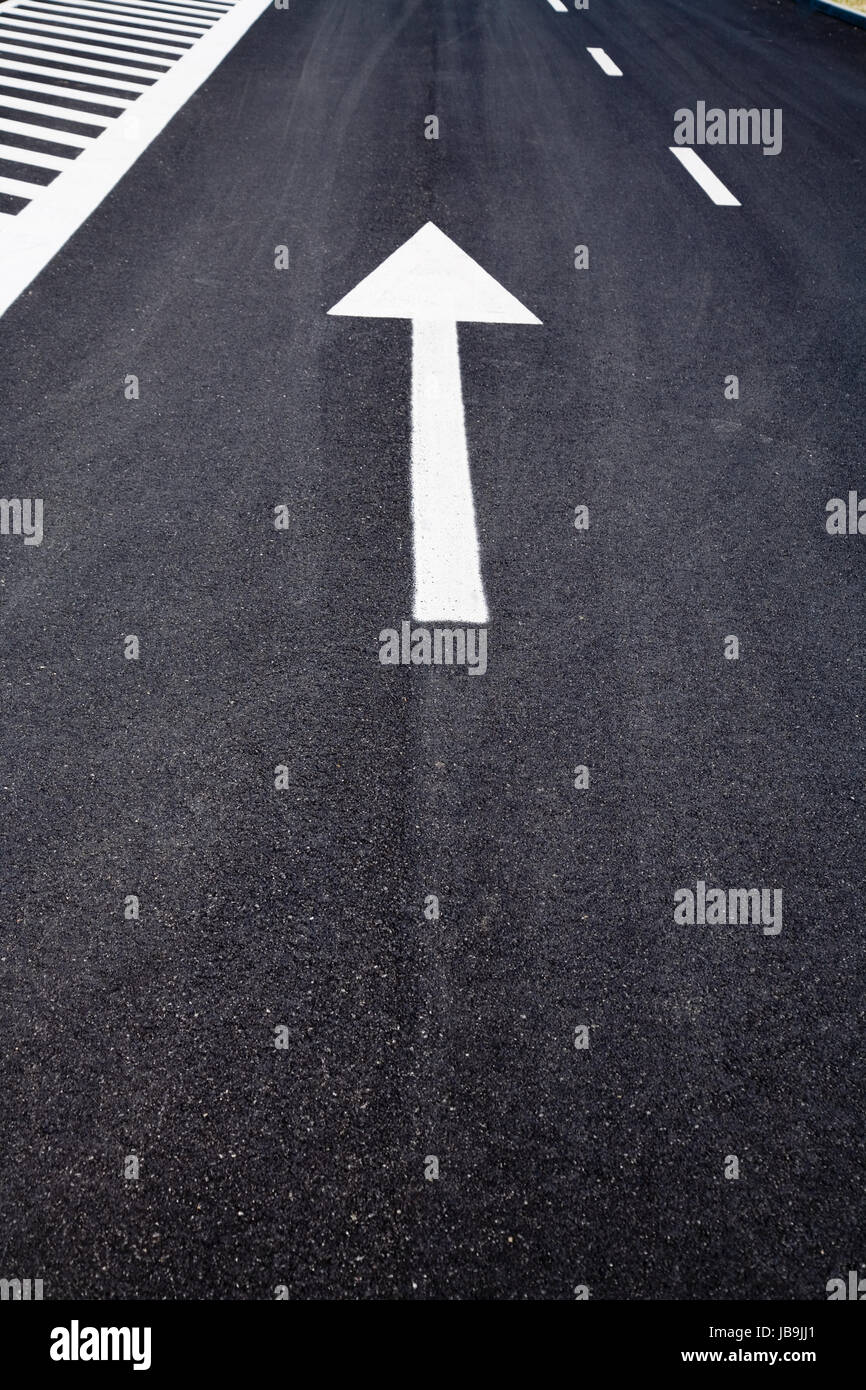 Arrow sign as road markings on a street Stock Photo - Alamy