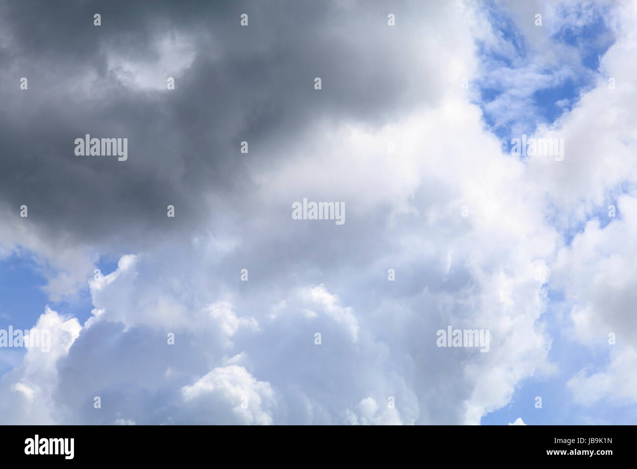 Dark brooding Cumulus clouds form during a warm spring day Stock Photo ...
