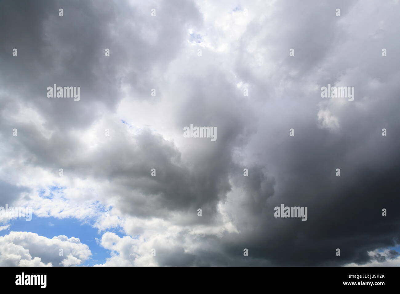 Dark brooding Cumulus clouds form during a warm spring day Stock Photo ...