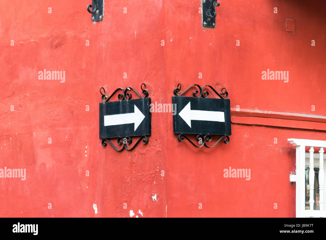 Two one way street signs on the corner of an old colonial historic ...