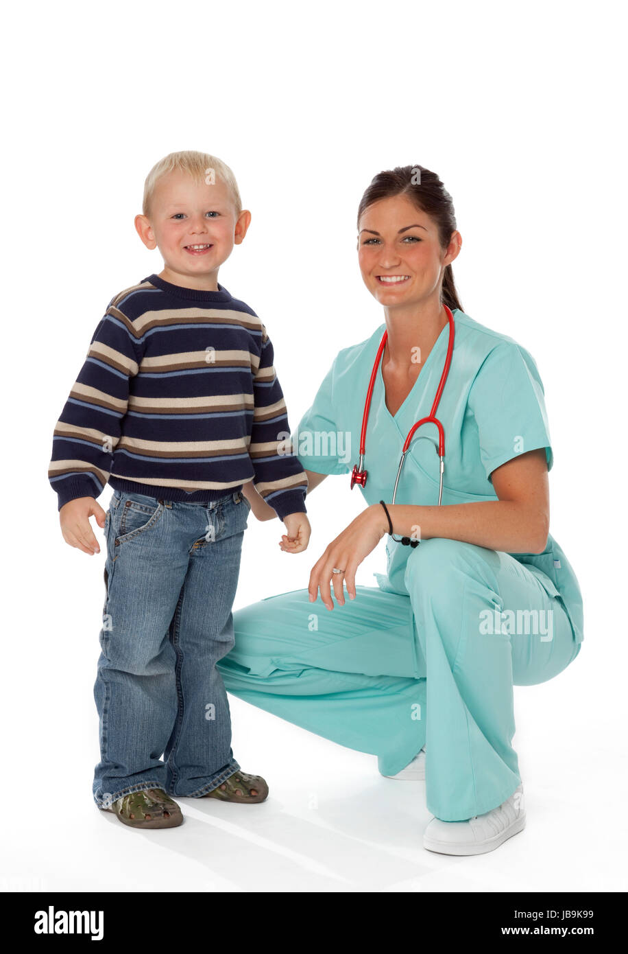 Pretty young nurse with young boy on white background Stock Photo - Alamy