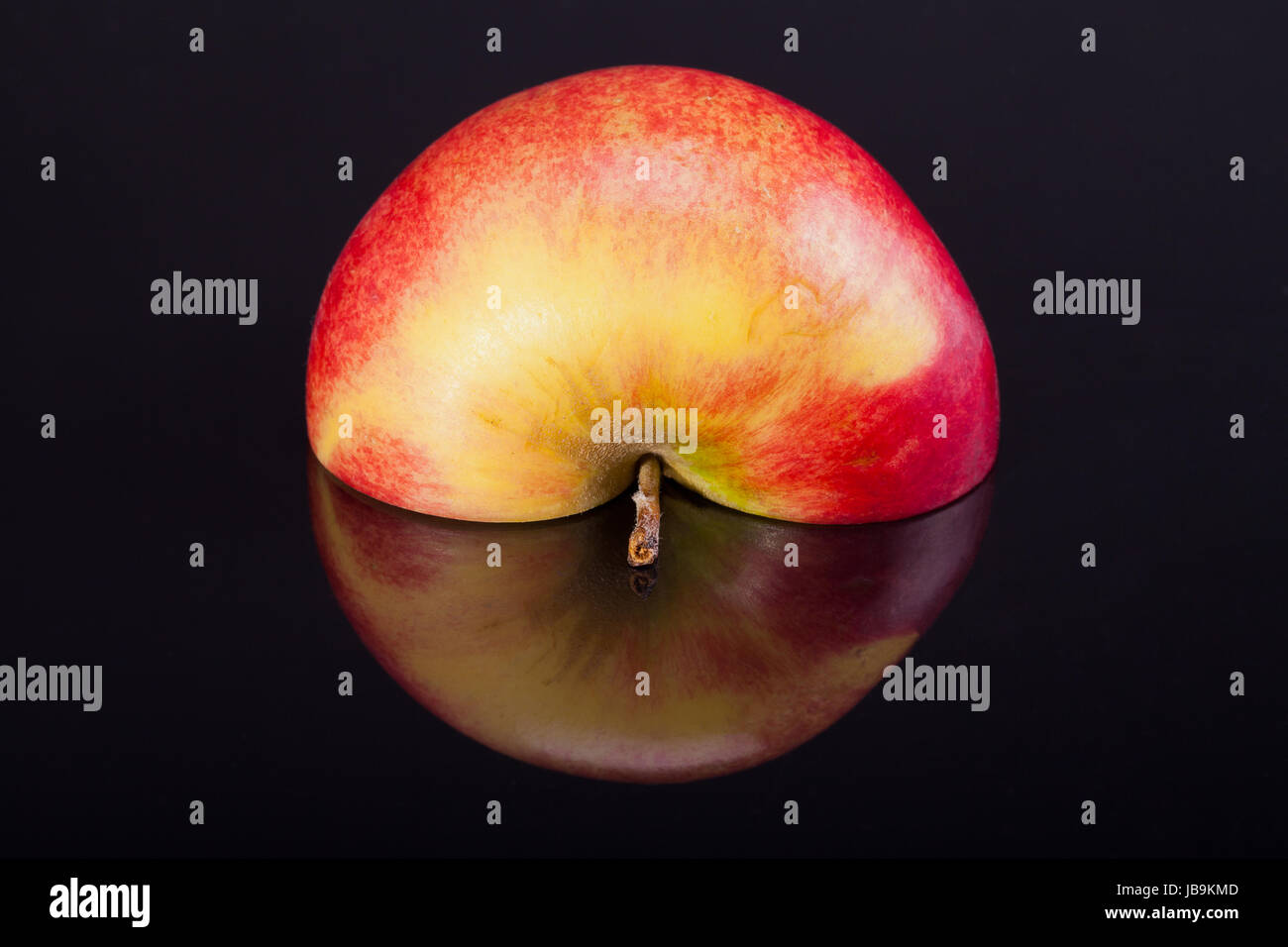 half of red apple with reflection isolated on black background Stock ...