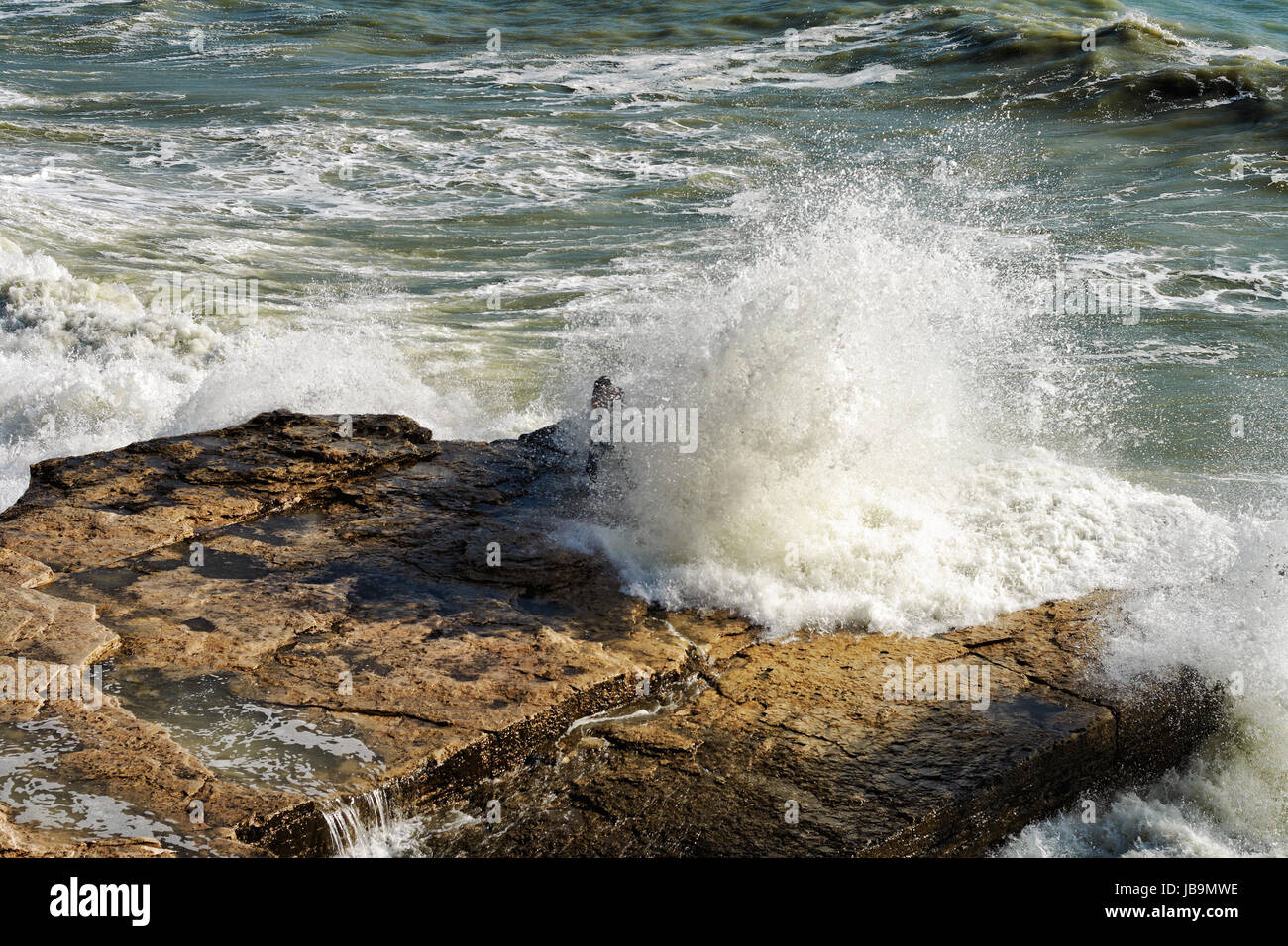 Storm on the Caspian Sea, the wave is breaking on the rocks Stock Photo ...