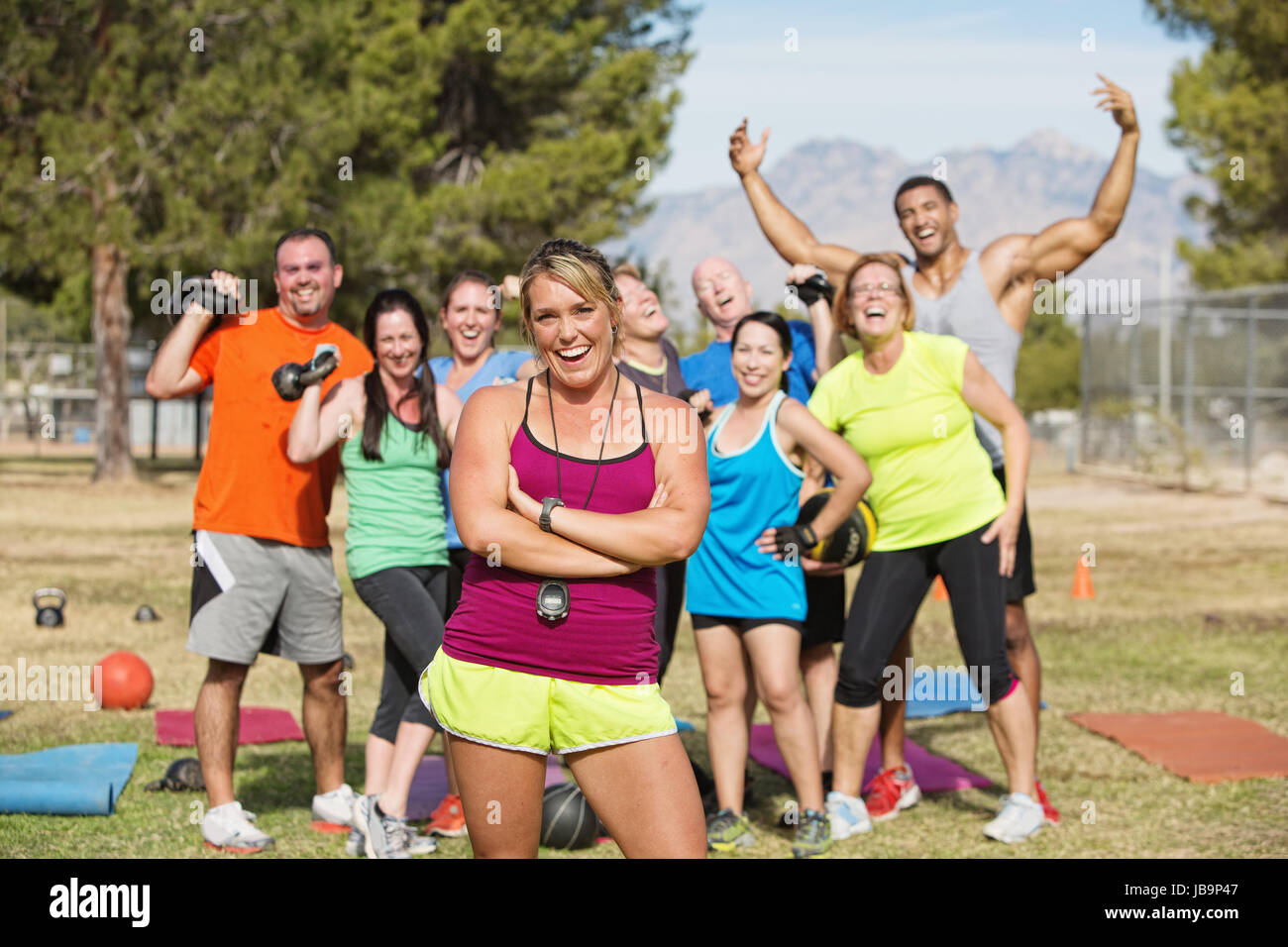 Group of happy people in boot camp fitness class Stock Photo - Alamy