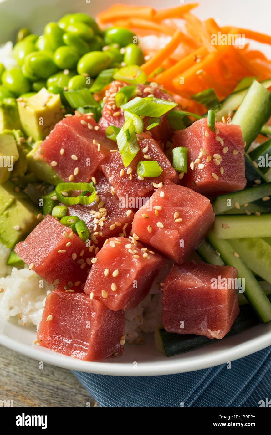 Raw Organic Ahi Tuna Poke Bowl with Rice and Veggies Stock Photo - Alamy