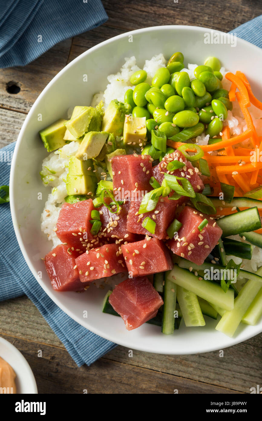 Raw Organic Ahi Tuna Poke Bowl with Rice and Veggies Stock Photo - Alamy