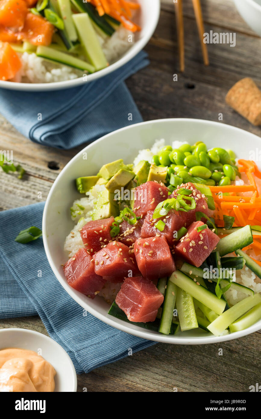 Raw Organic Ahi Tuna Poke Bowl with Rice and Veggies Stock Photo - Alamy
