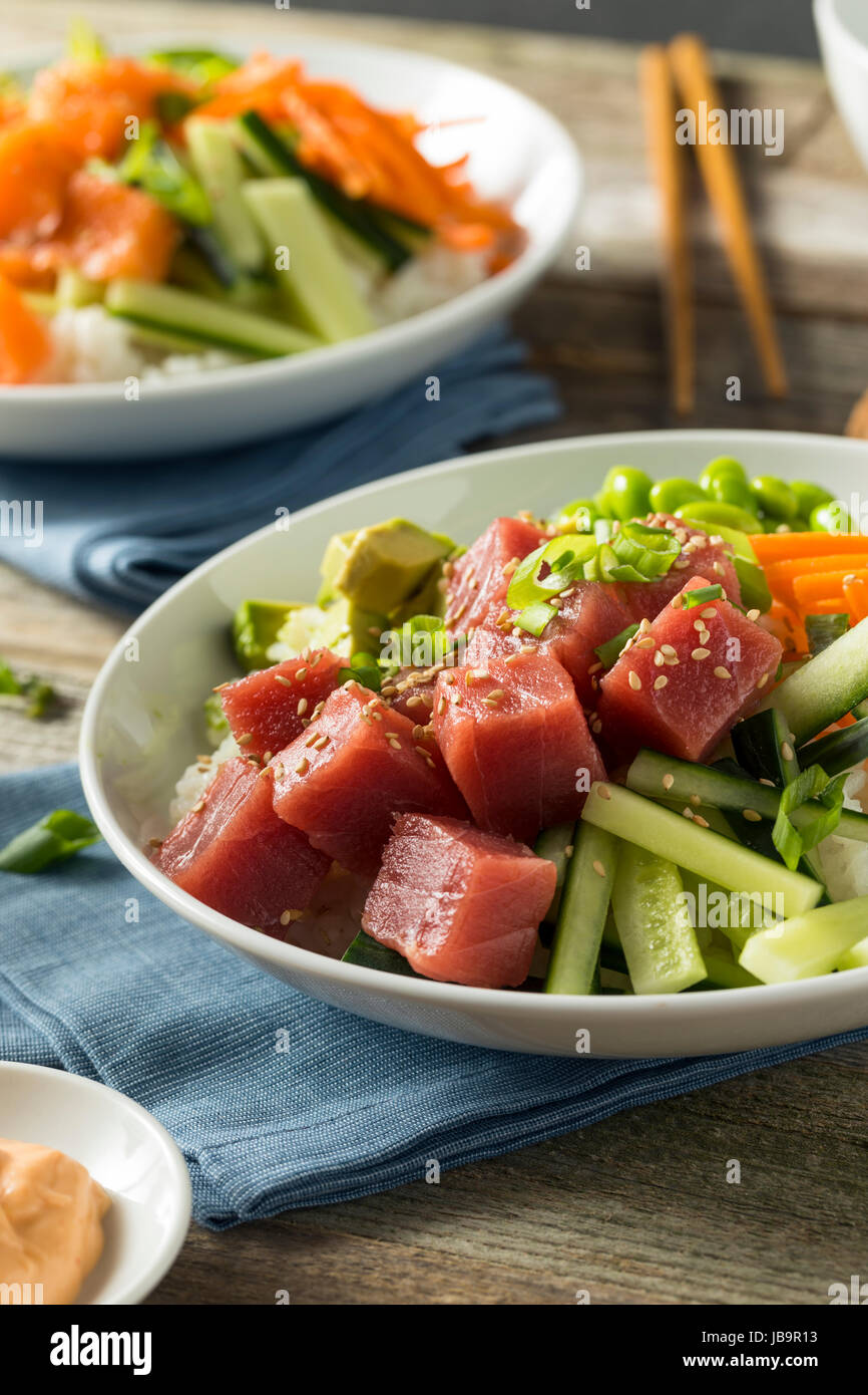 Raw Organic Ahi Tuna Poke Bowl with Rice and Veggies Stock Photo - Alamy