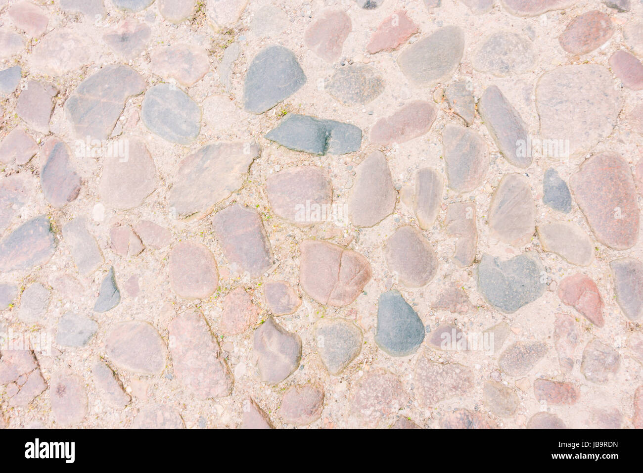 Old stone pavement background textures. Top view Stock Photo - Alamy