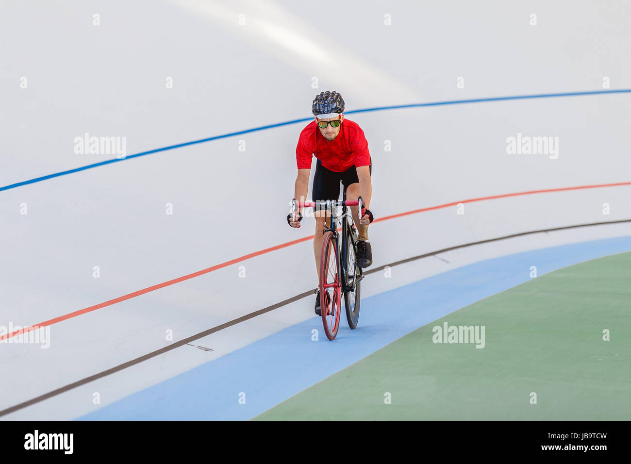 Racing cyclist on velodrome outdoor Stock Photo - Alamy