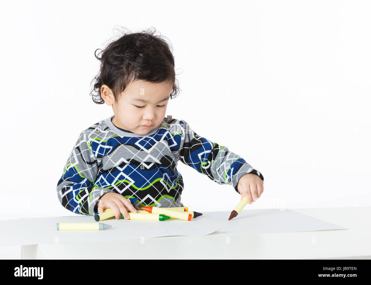 Little boy concentrate on drawing Stock Photo - Alamy