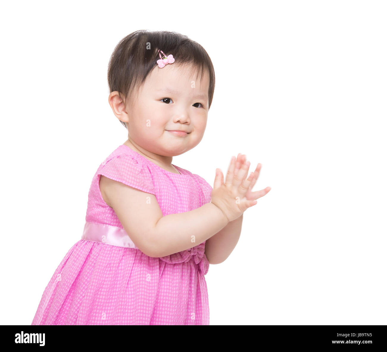 Asian baby girl clapping hand Stock Photo - Alamy