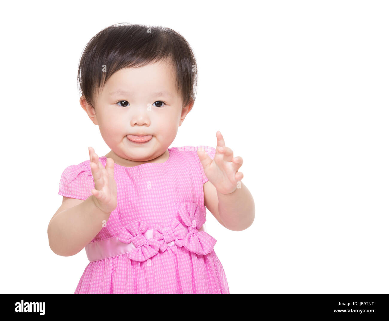 Asia baby girl making funny face and clapping hand Stock Photo - Alamy