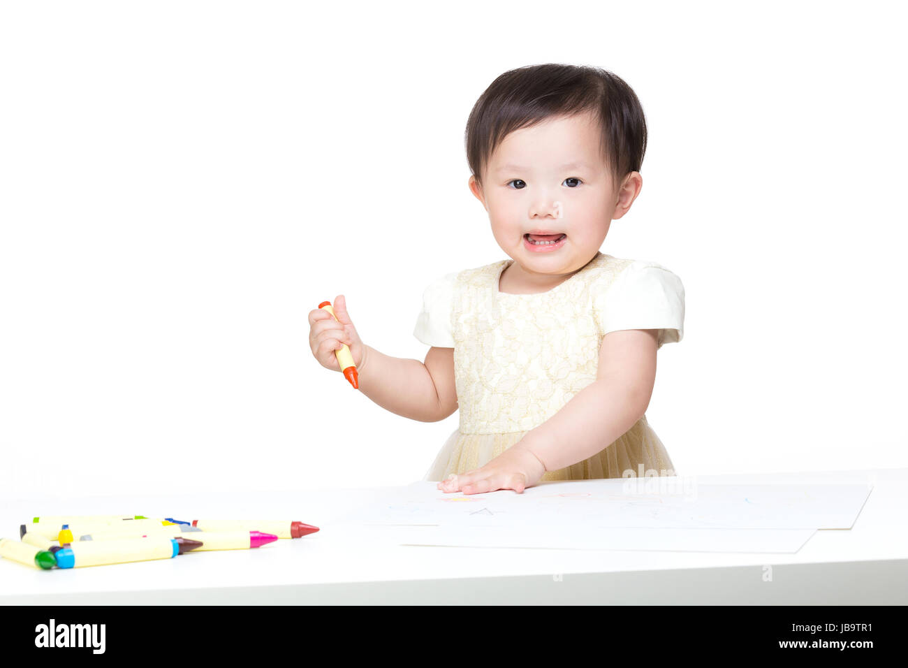 Asian baby girl drawing picture Stock Photo - Alamy