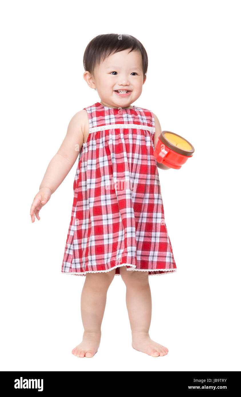 Baby Girl standing with snack box Stock Photo - Alamy