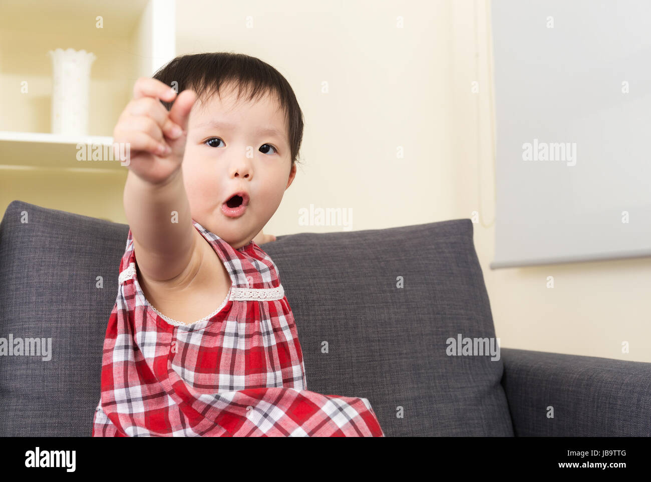 Asia baby girl point to you Stock Photo - Alamy