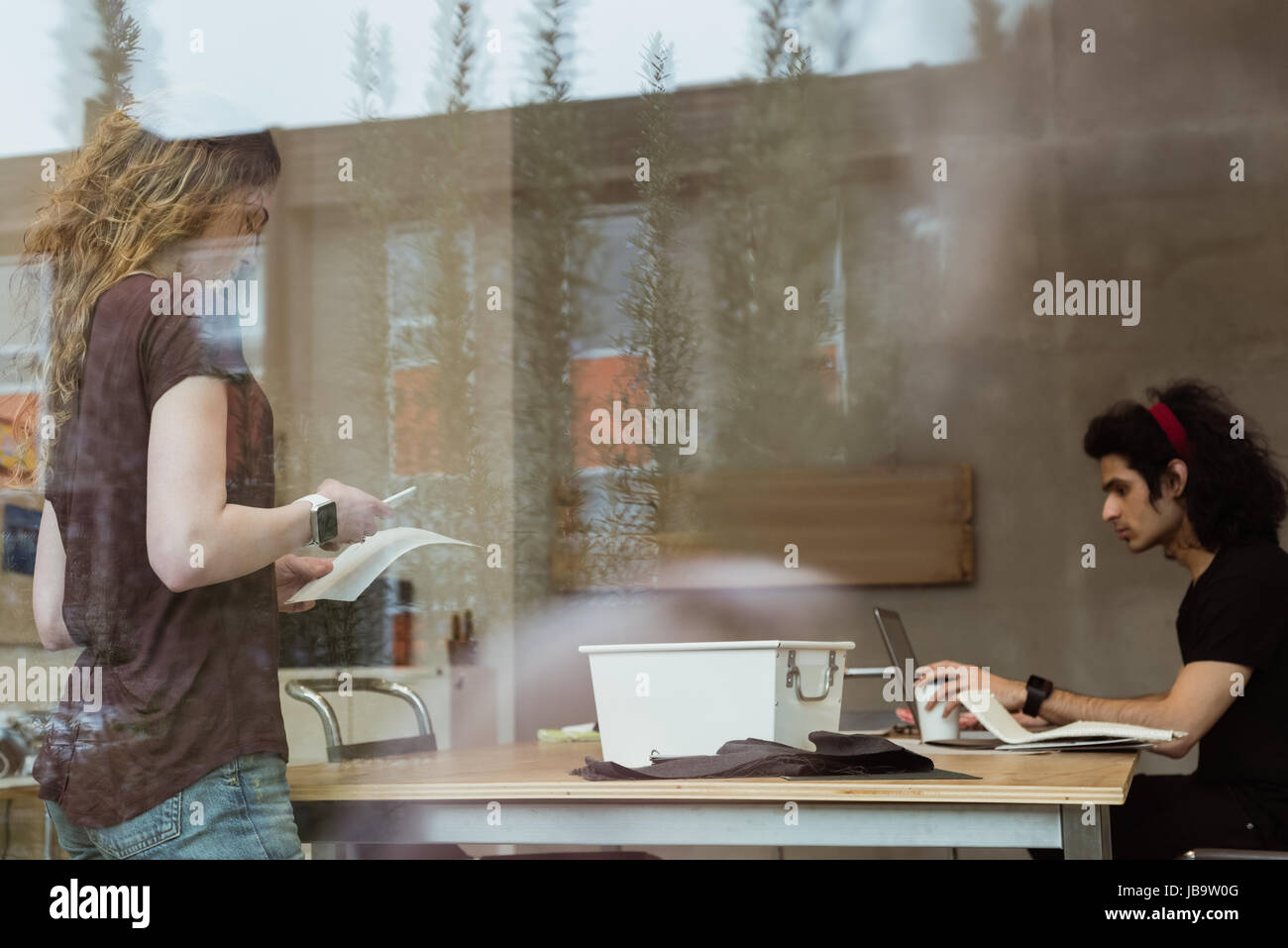 Attentive business colleagues working in office Stock Photo - Alamy