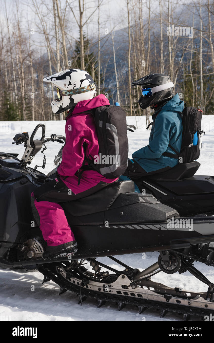 Woman sitting on snowmobile hi-res stock photography and images - Alamy