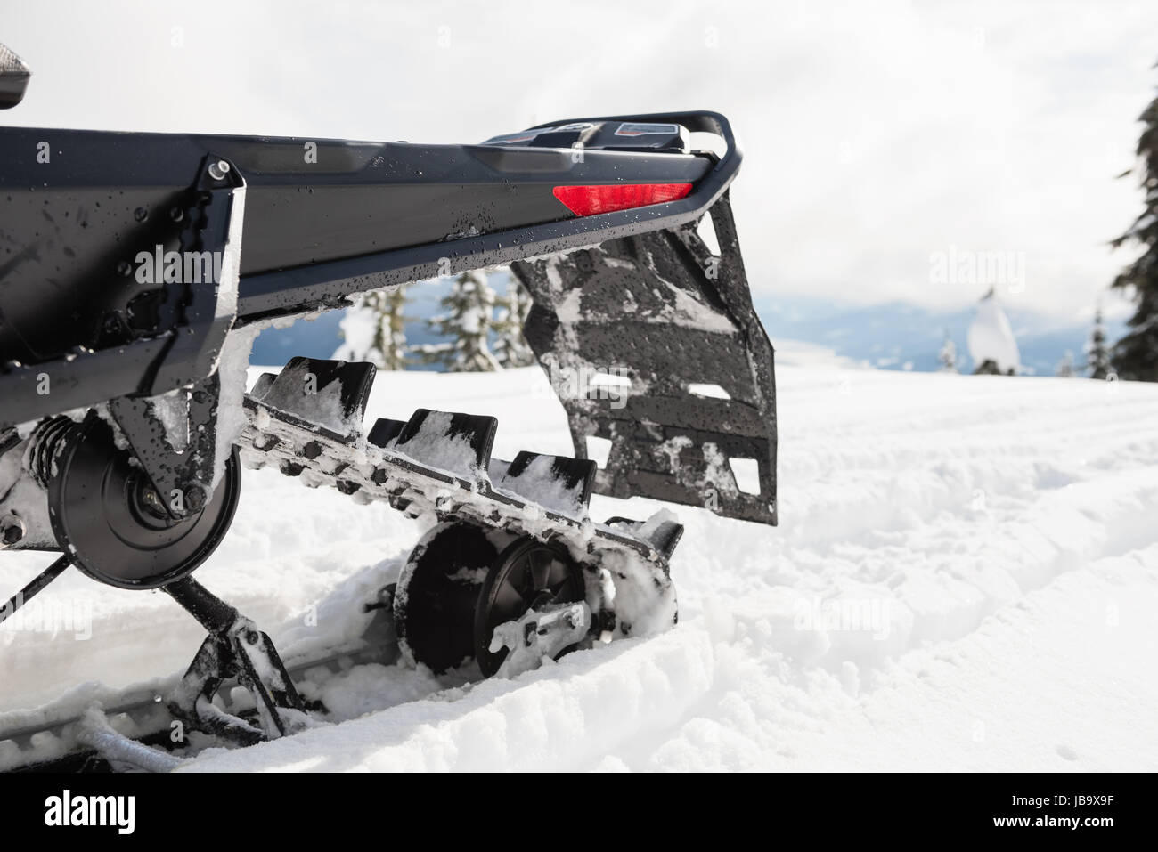 Snowmobile in snowy alps during winter Stock Photo - Alamy