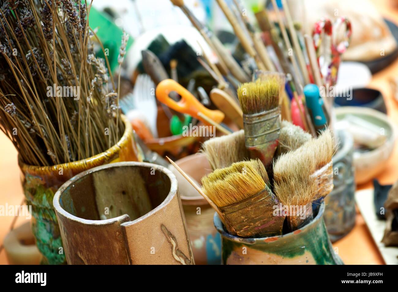 Group of brushes and tools n an artist's workshop Stock Photo - Alamy