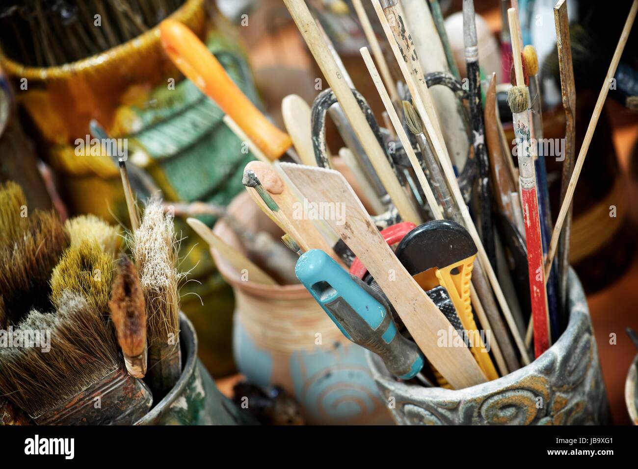 Group of brushes and tools n an artist's workshop Stock Photo - Alamy