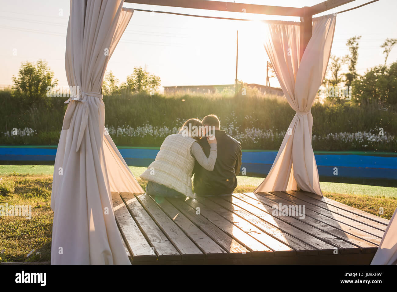 couple hugging in nature back view Stock Photo - Alamy