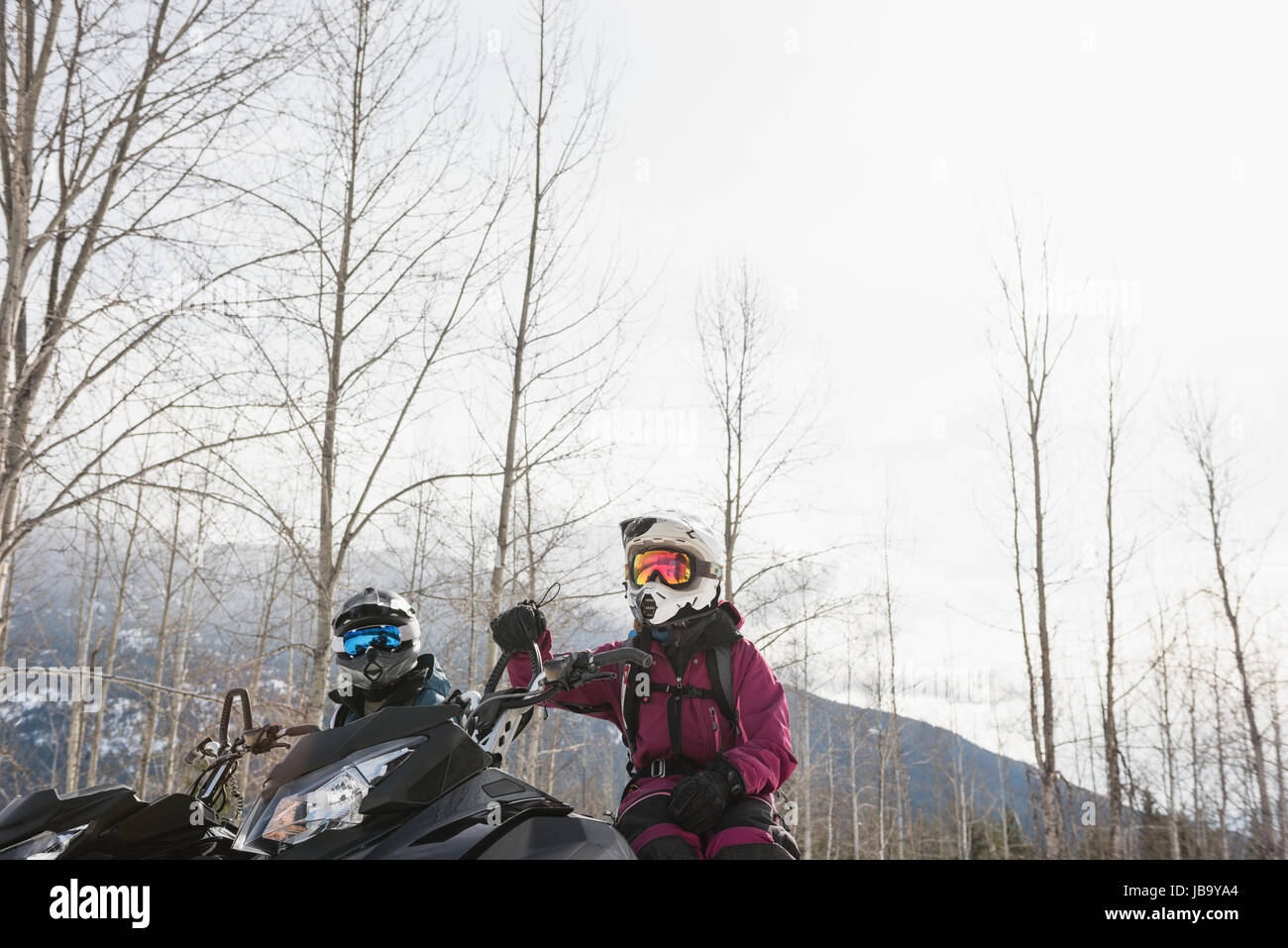 Snowmobiling couple hi-res stock photography and images - Alamy