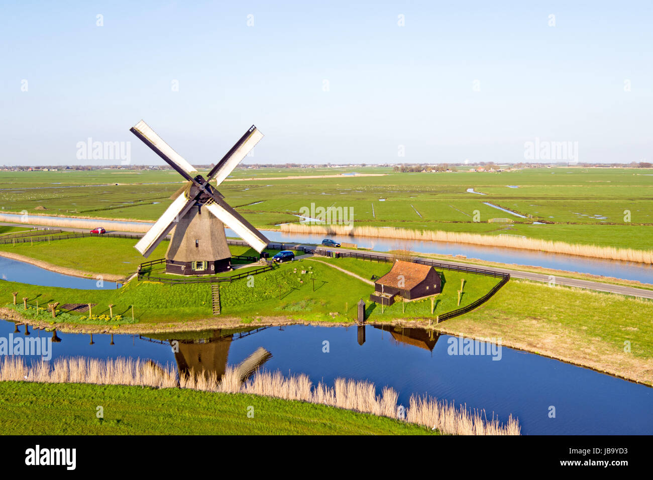 Traditional windmill in a dutch landscape Stock Photo - Alamy