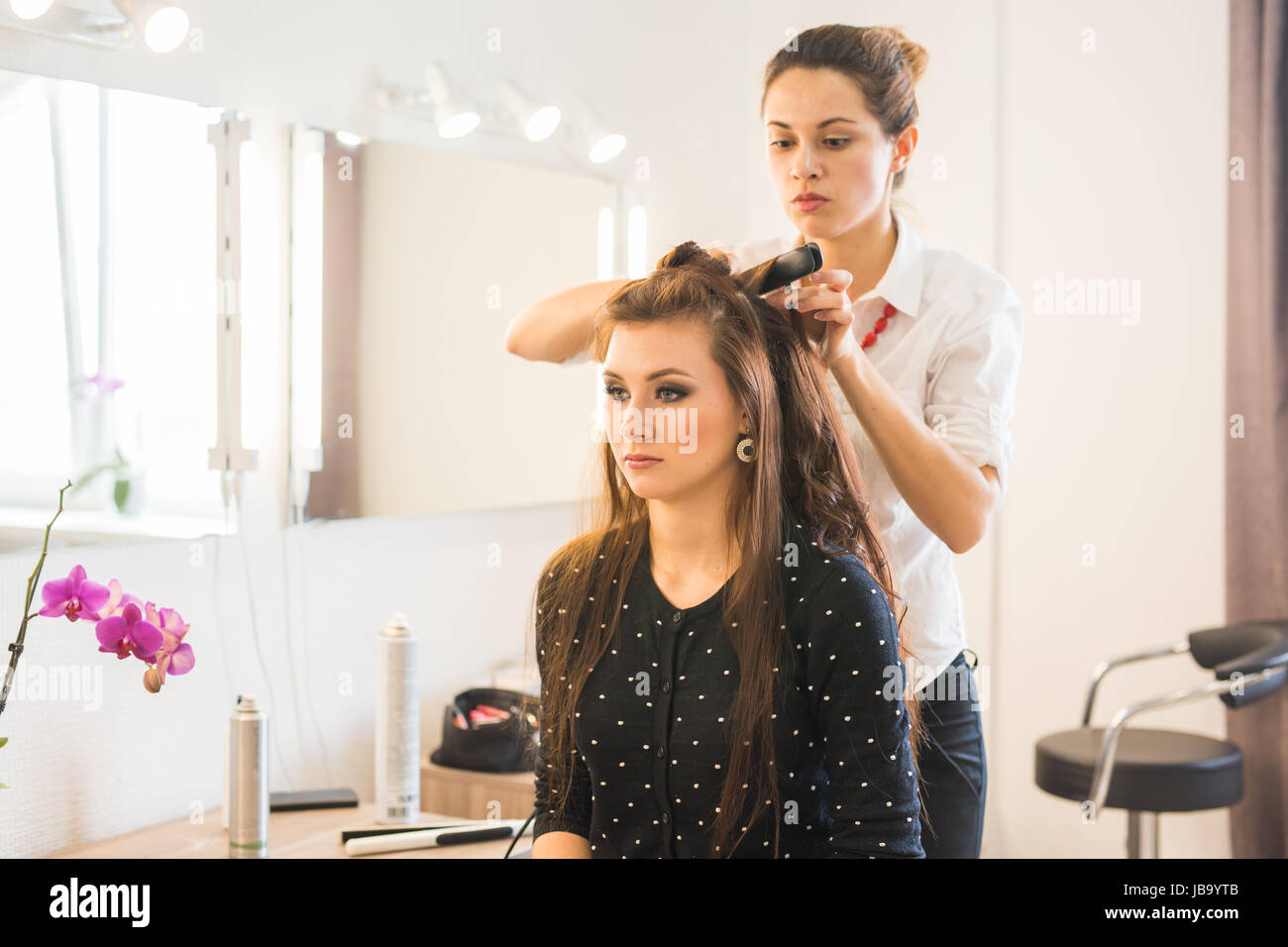 Hairdresser doing haircut for women in hairdressing salon. Concept of ...