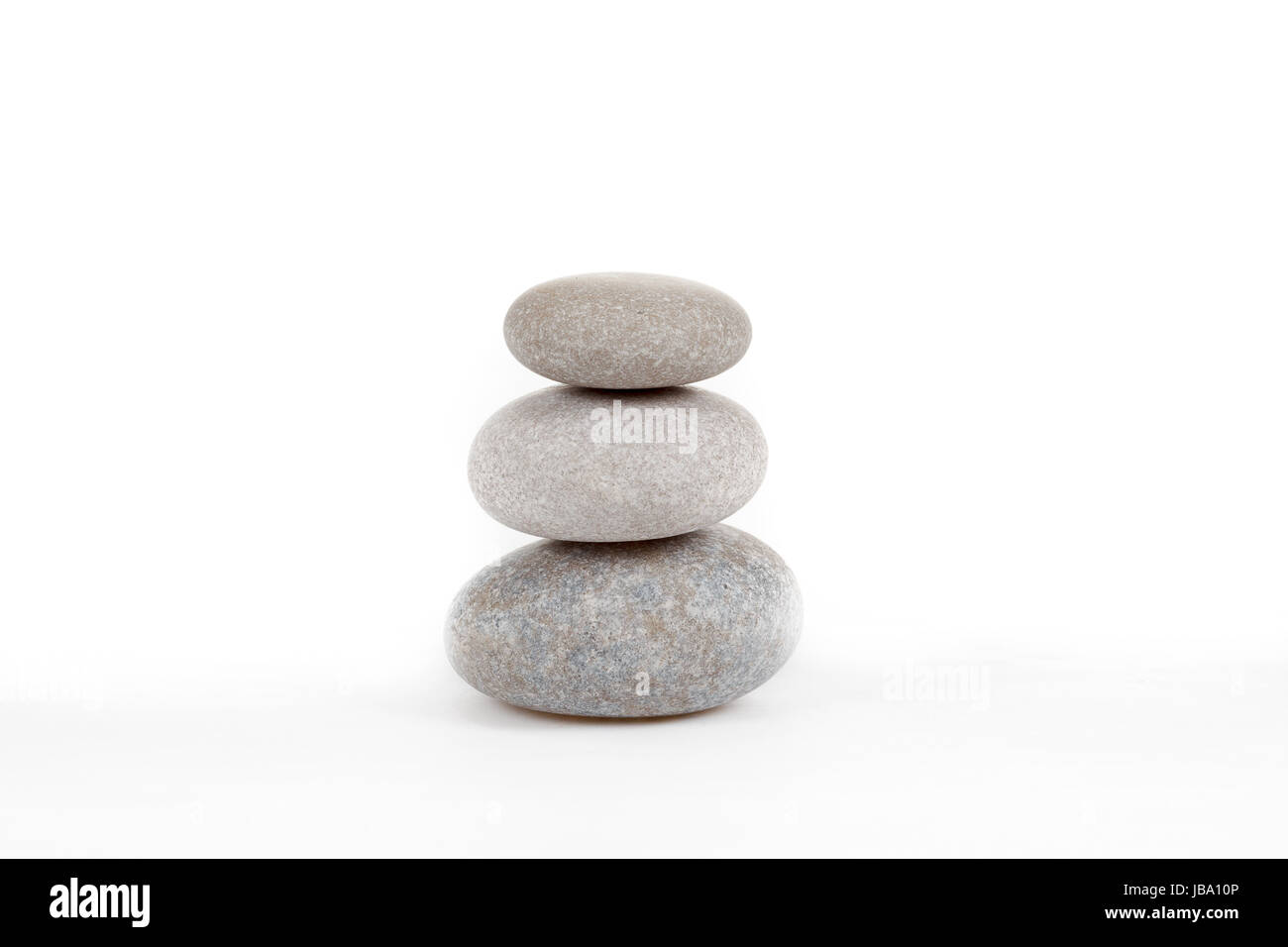 Balance of three zen stones isolated on white background Stock Photo ...