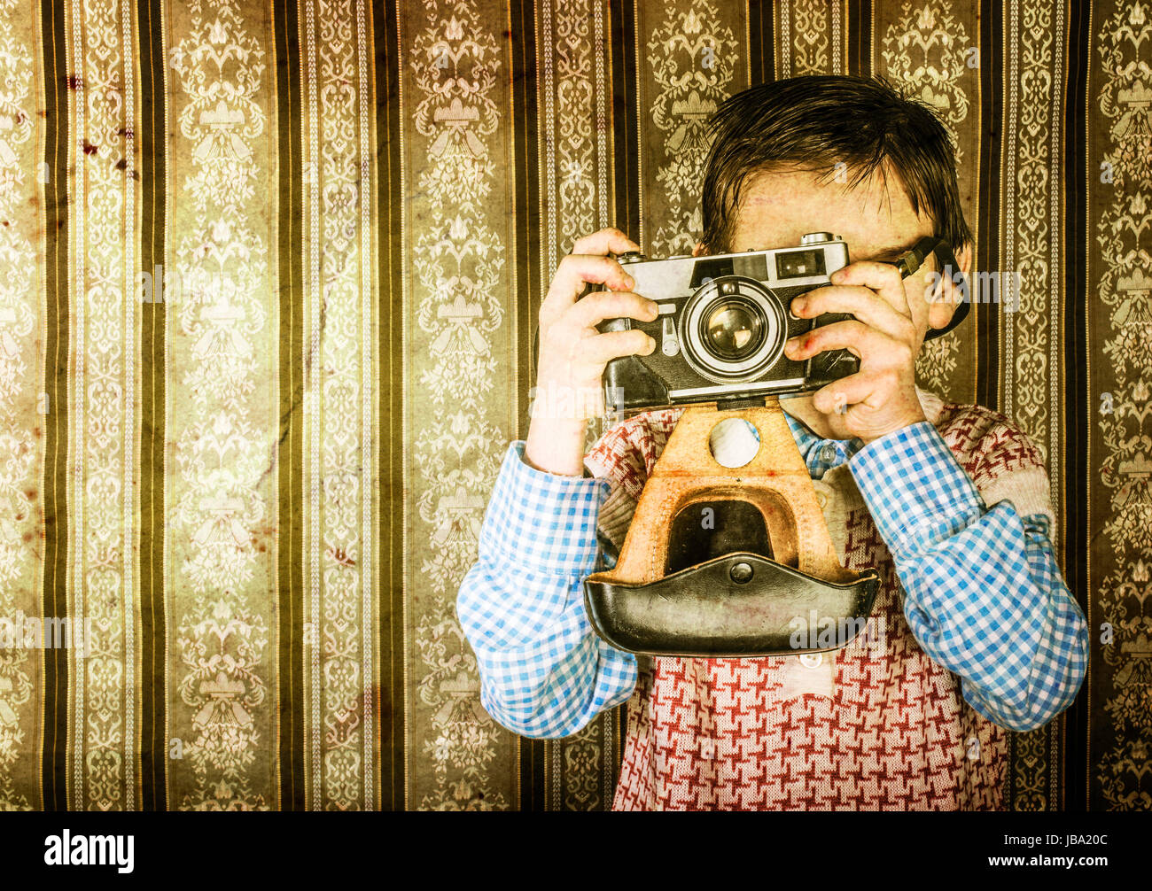 Boy with vintage camera. Vintage clothes Stock Photo - Alamy