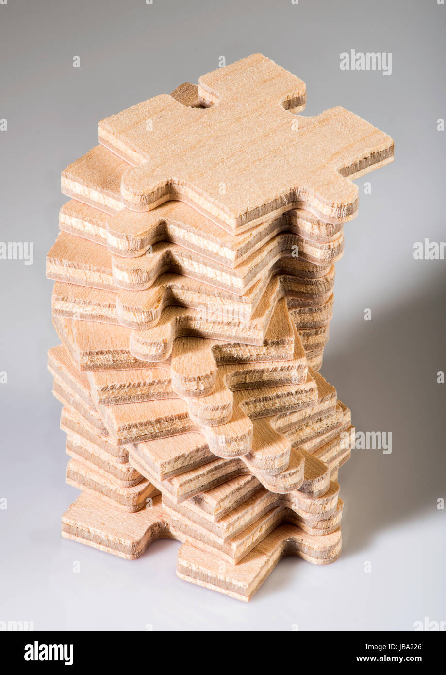 Wooden puzzle on white background. Pile of puzzle Stock Photo - Alamy