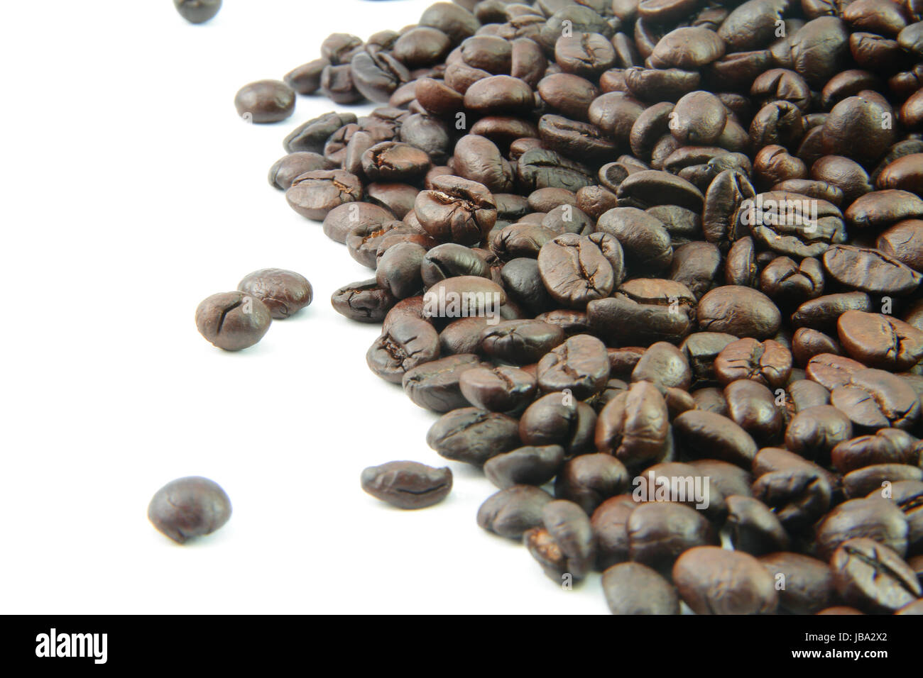 many coffee beans on the white background Stock Photo - Alamy