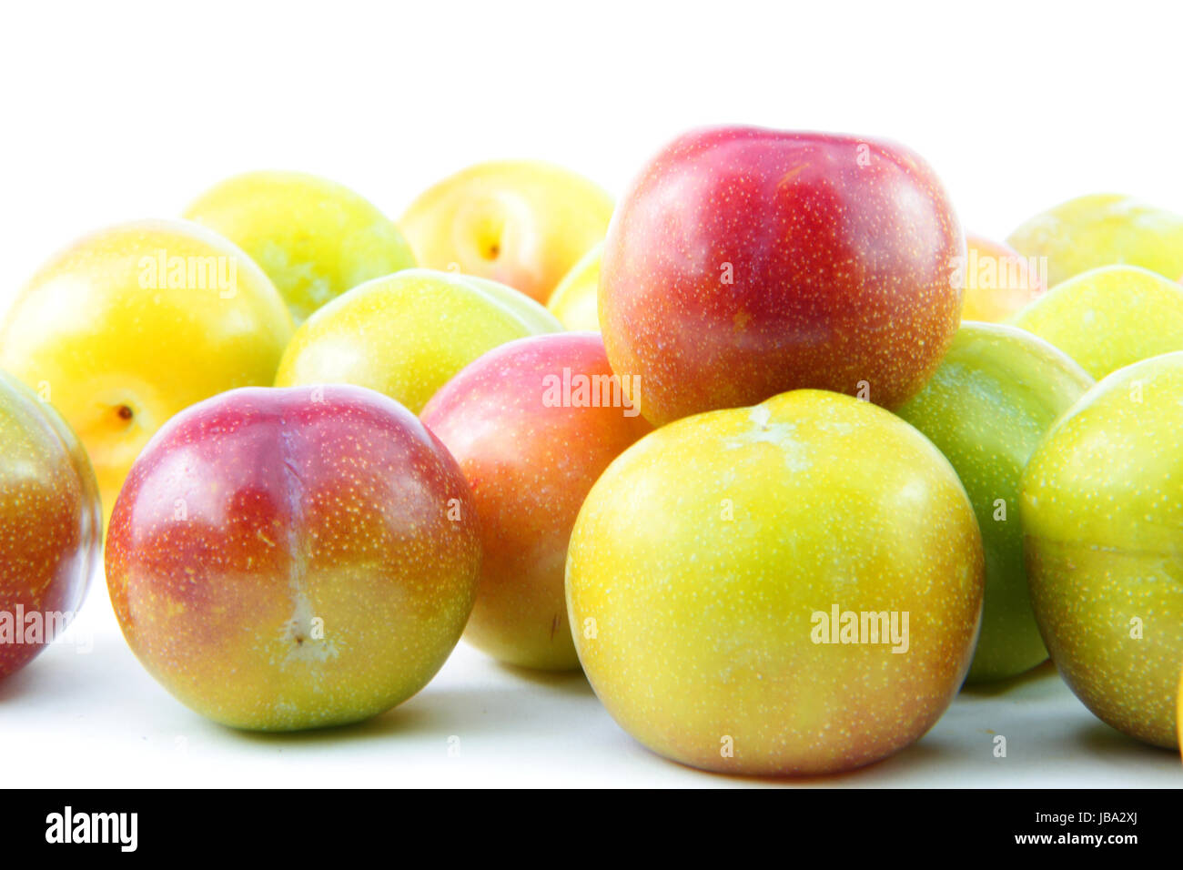 some delicious plum with pure white background Stock Photo - Alamy