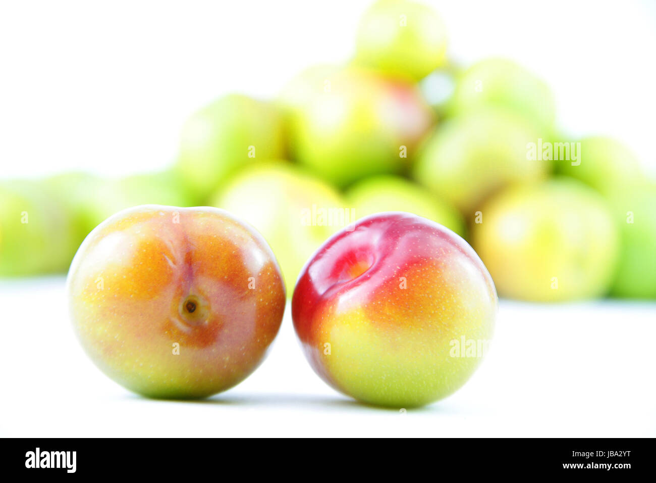 some delicious plum with pure white background Stock Photo - Alamy