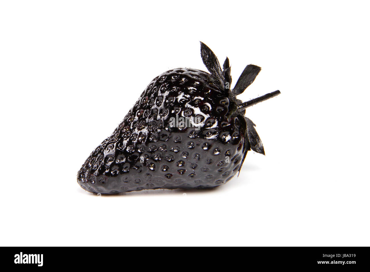 one black strawberry isolated on the white background Stock Photo - Alamy