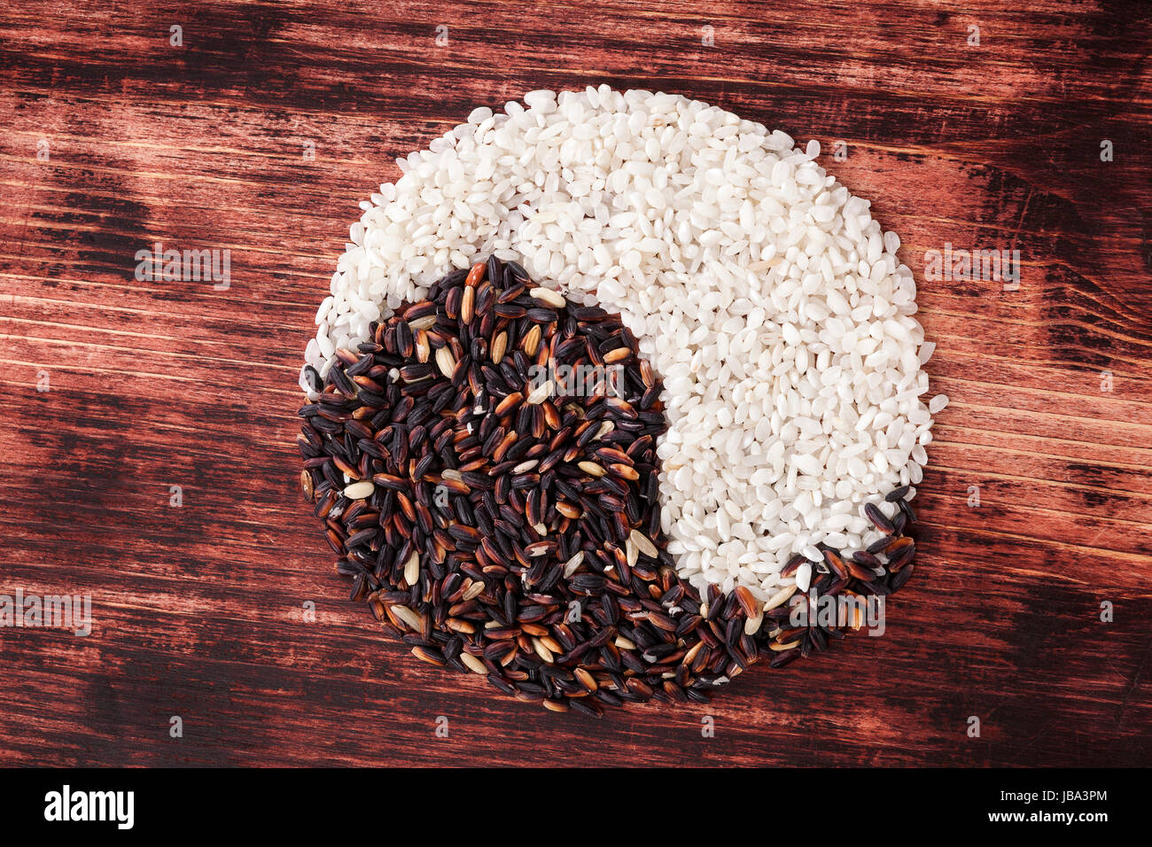 White and wild rice forming Yin Yang Symbol. Healthy balanced cooking ...