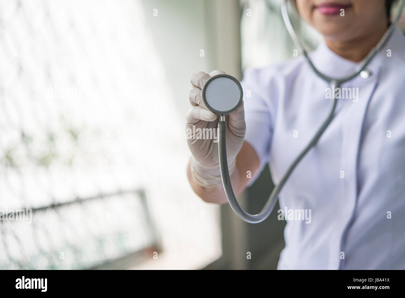 Female nurse with a stethoscope in the hands Stock Photo - Alamy