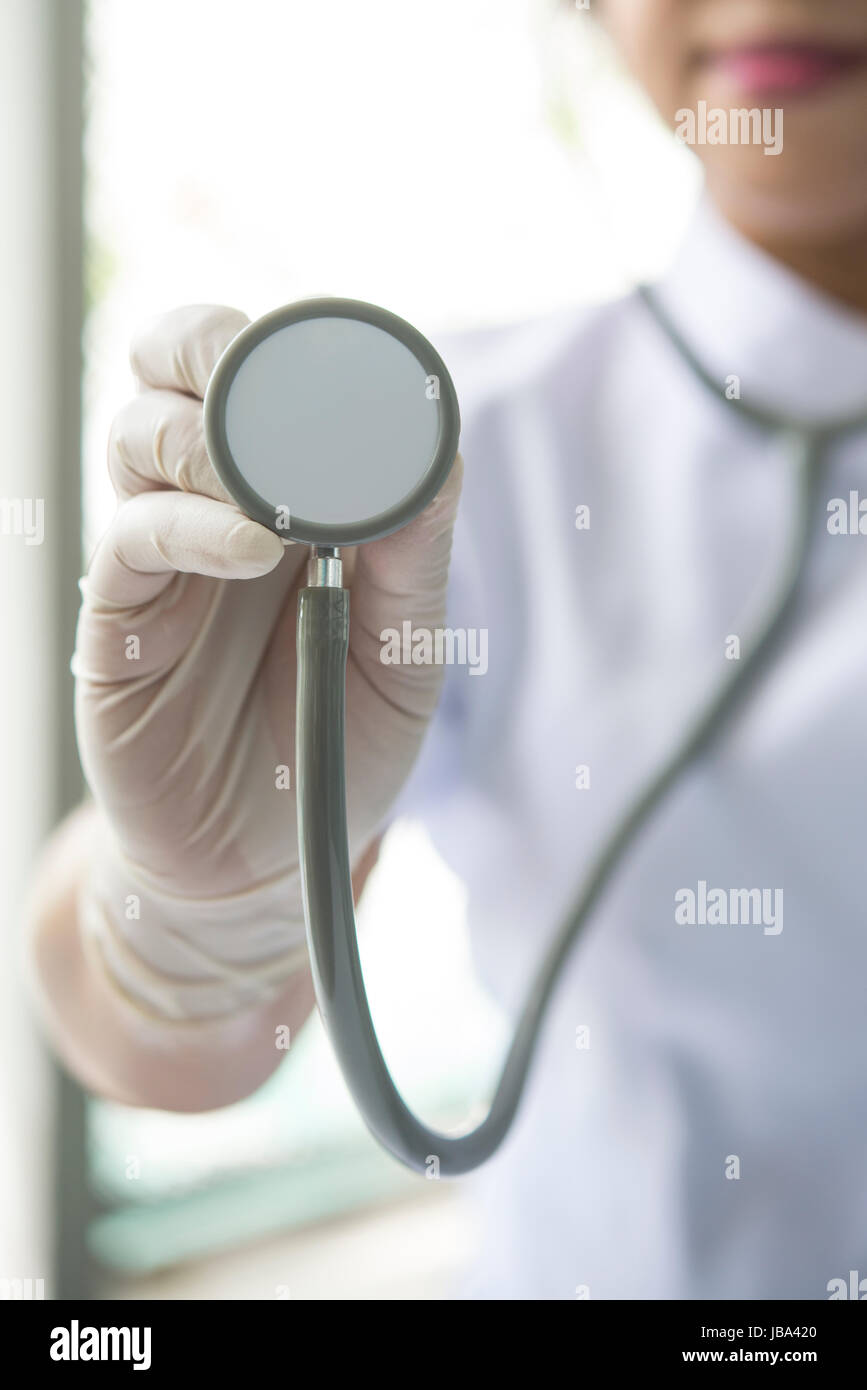 Female nurse with a stethoscope in the hands Stock Photo - Alamy