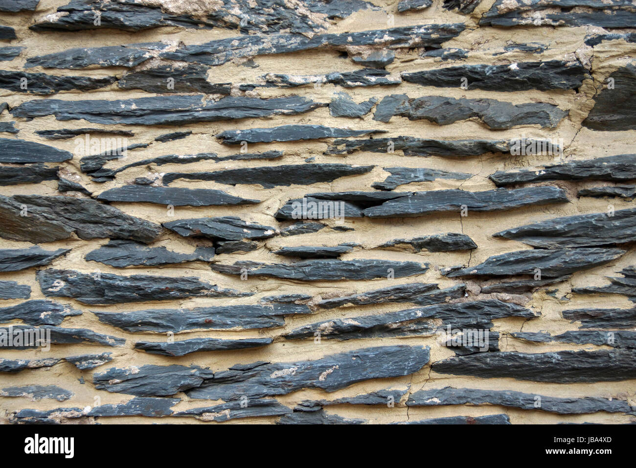 A background image of an old shale rock wall Stock Photo - Alamy