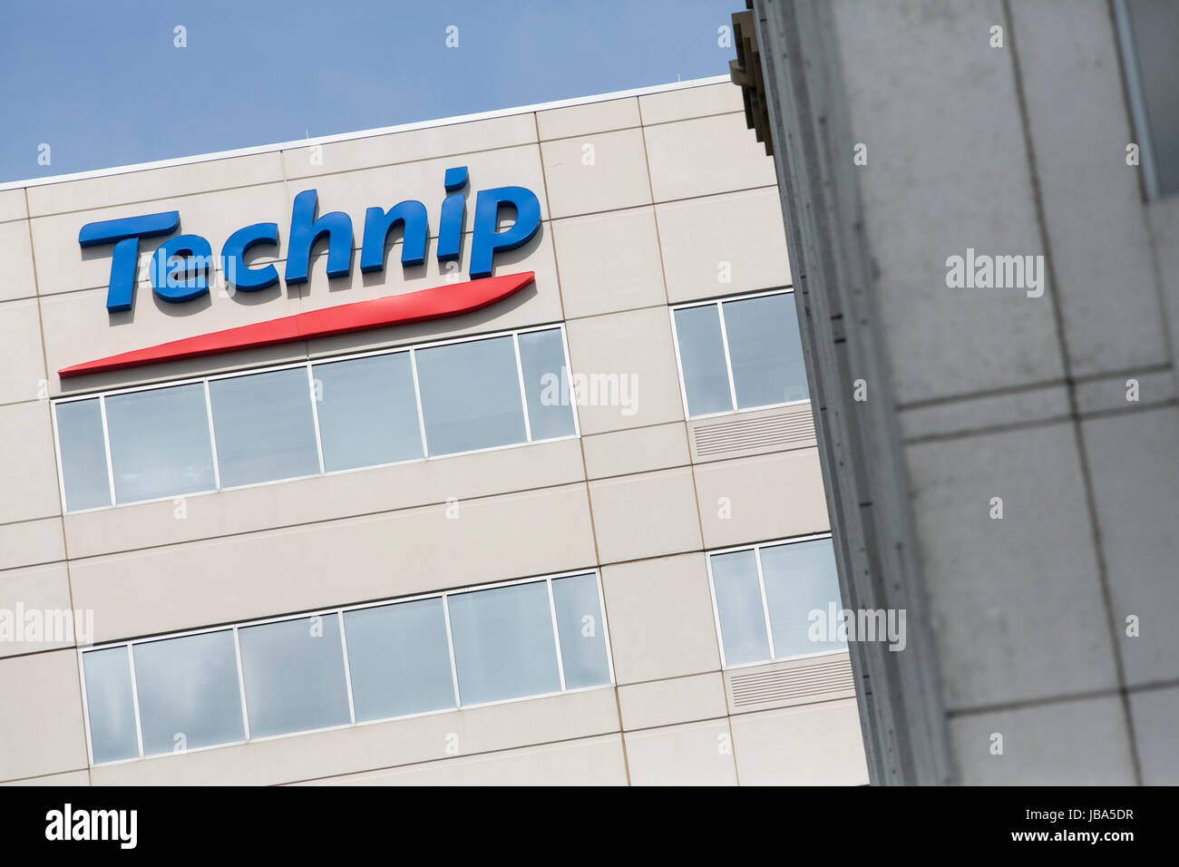 A logo sign outside of a facility occupied by Technip in Houston, Texas ...