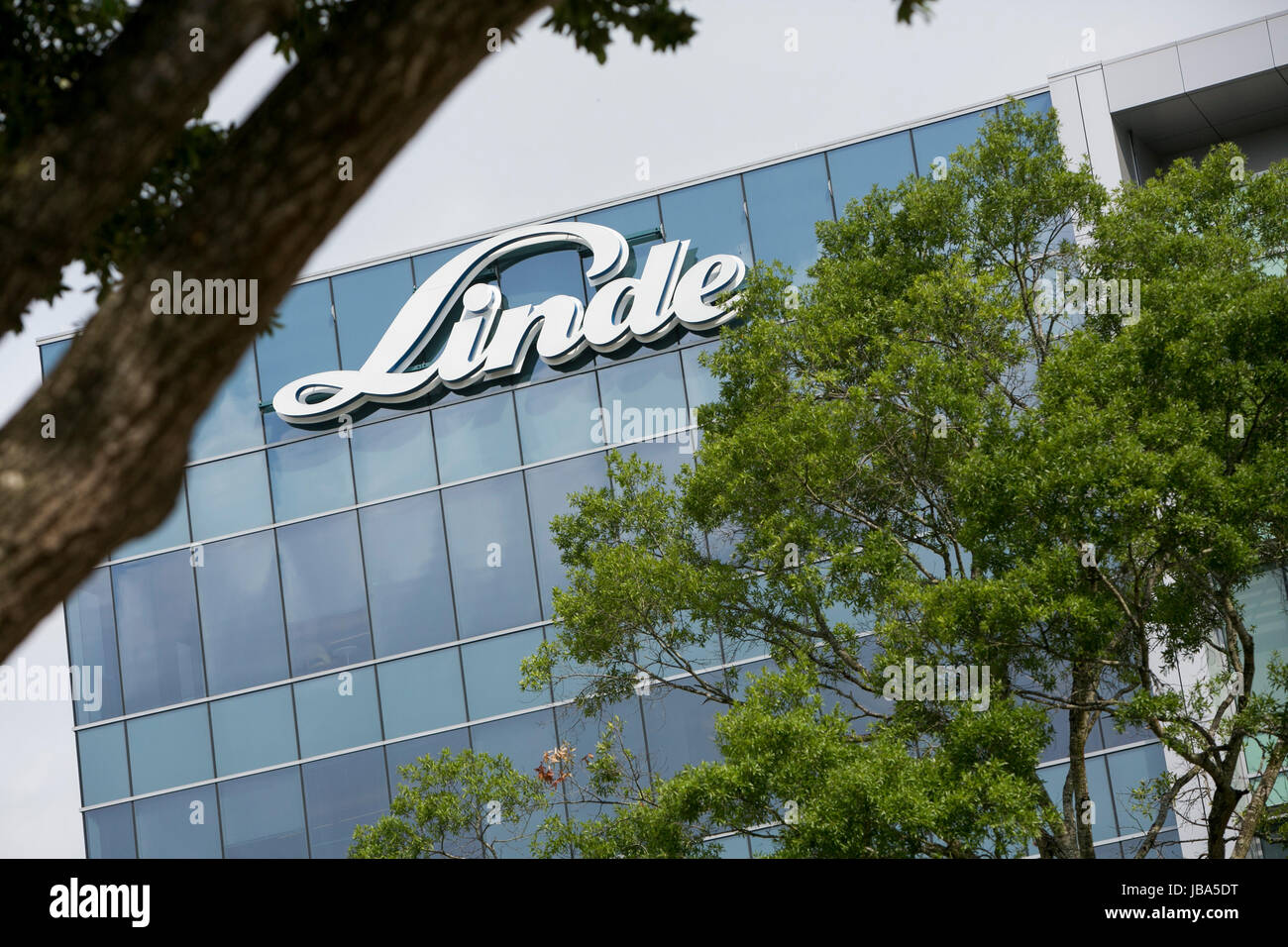 A logo sign outside of a facility occupied by The Linde Group in ...