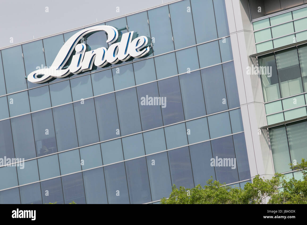 A logo sign outside of a facility occupied by The Linde Group in ...