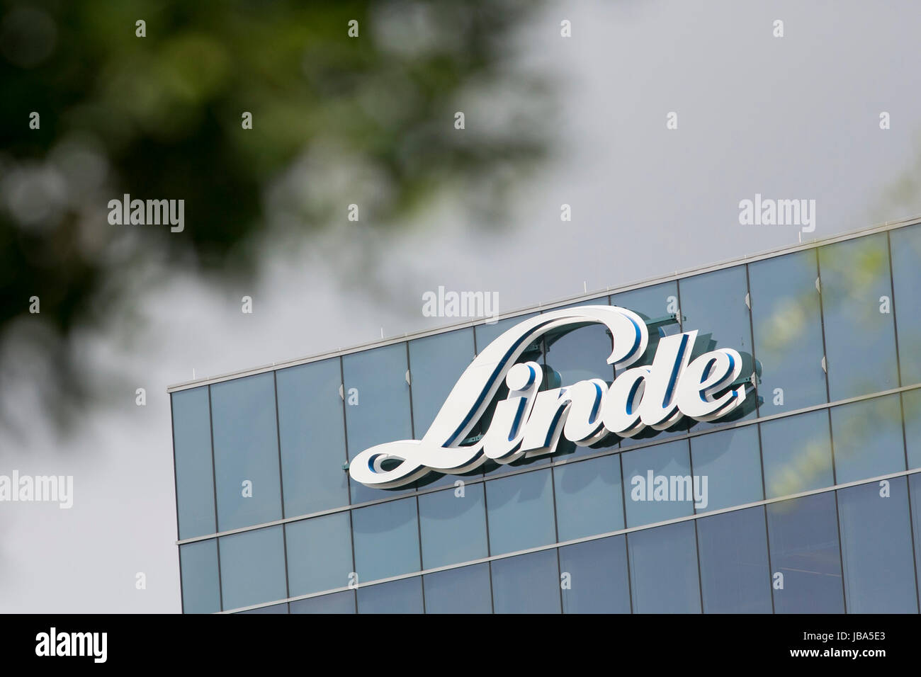 A logo sign outside of a facility occupied by The Linde Group in ...