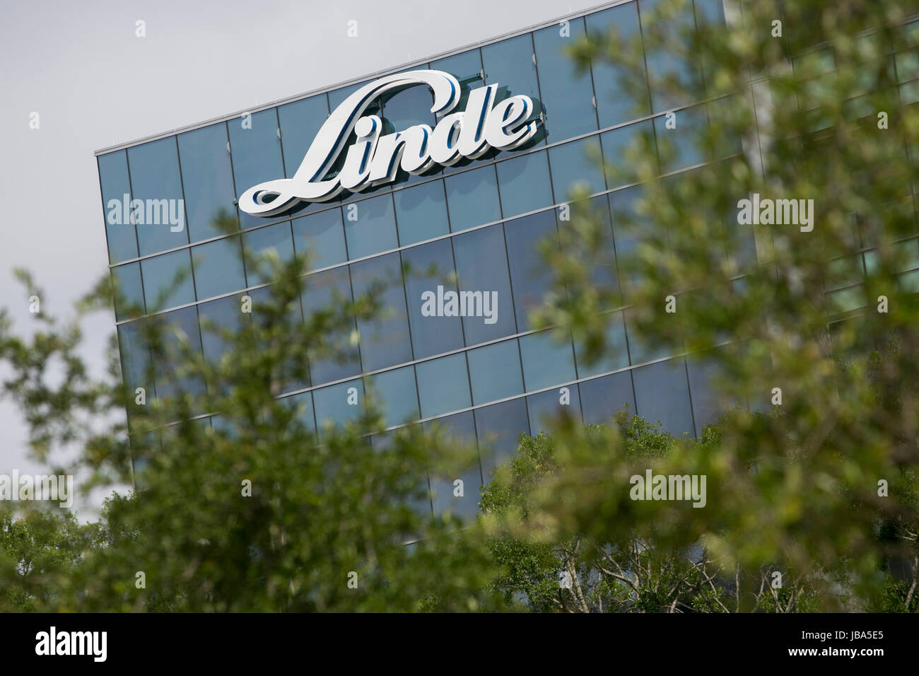 A logo sign outside of a facility occupied by The Linde Group in ...